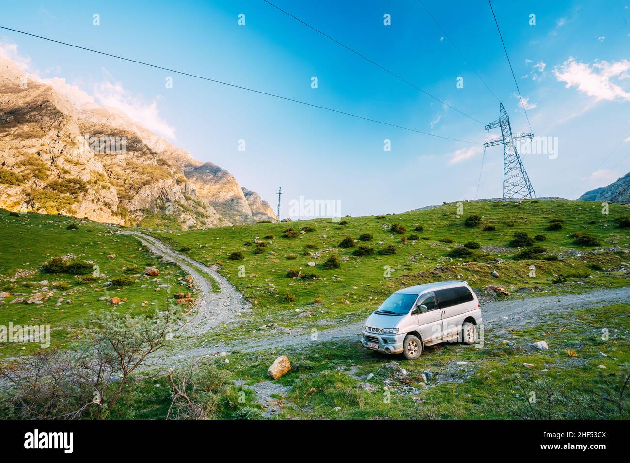 Mitsubishi Delica Space Gear on off road in summer mountains landscape ...