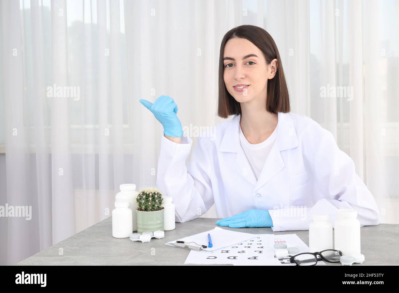 Female trainee doctor sitting on his workplace Stock Photo - Alamy