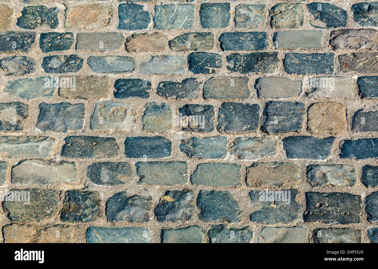 historic old cobbled road as background Stock Photo - Alamy