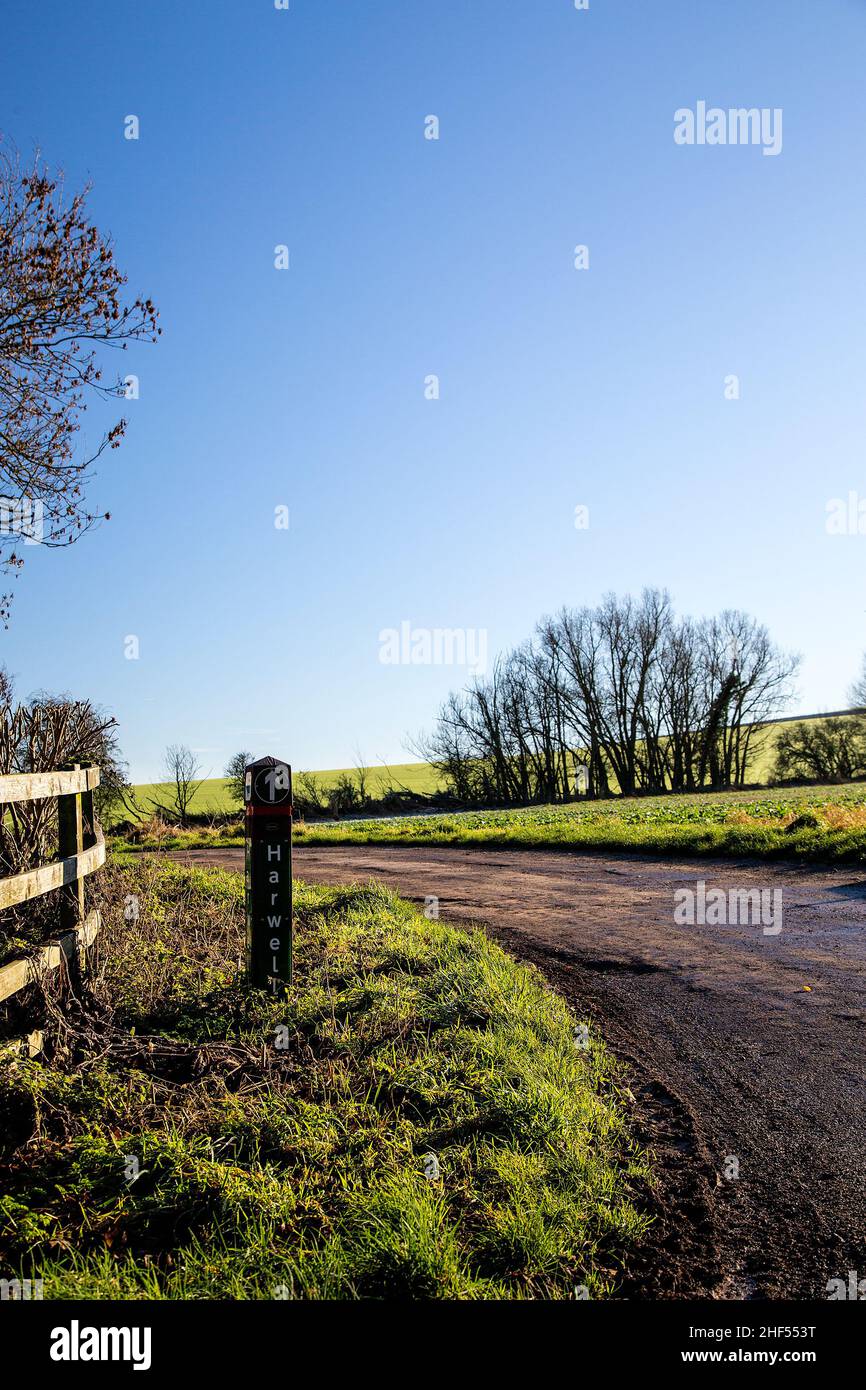 Rural signposts against a bright blue winter sky in the village of ...