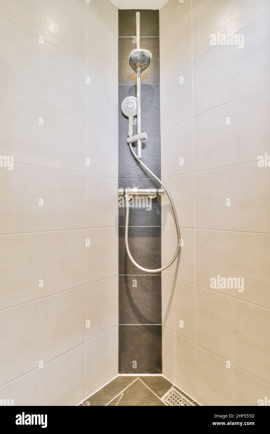 Delightful shower room with modern faucet in a luxury bathroom Stock ...