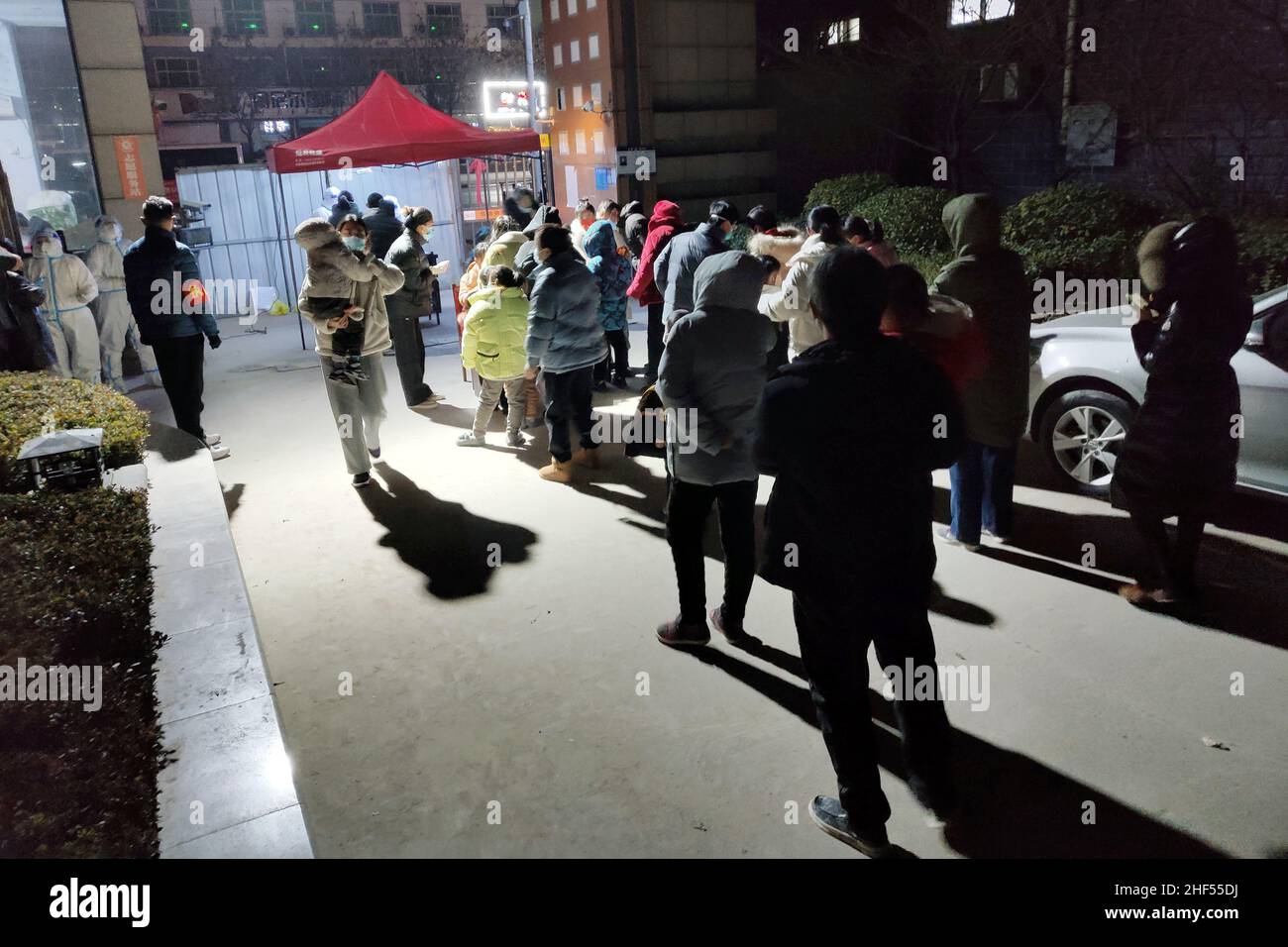 ANYANG, CHINA - JANUARY 14, 2022 - Residents line up for the fourth ...