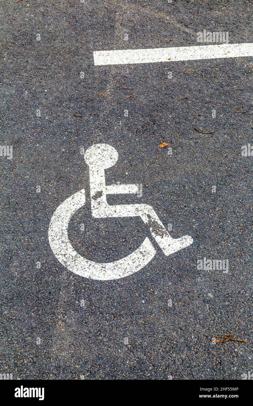 Disabled parking permit sign painted on the street Stock Photo - Alamy