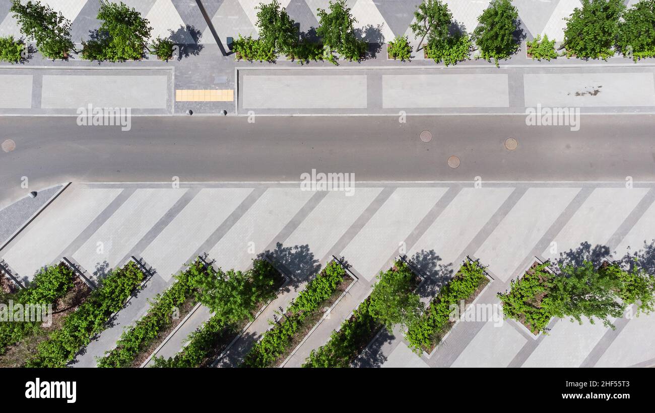 aerial top view of street with parking lot near new residential housing ...