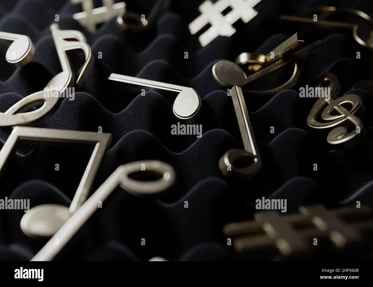 A concept showing a section of grey sound foam with gold music symbols ...