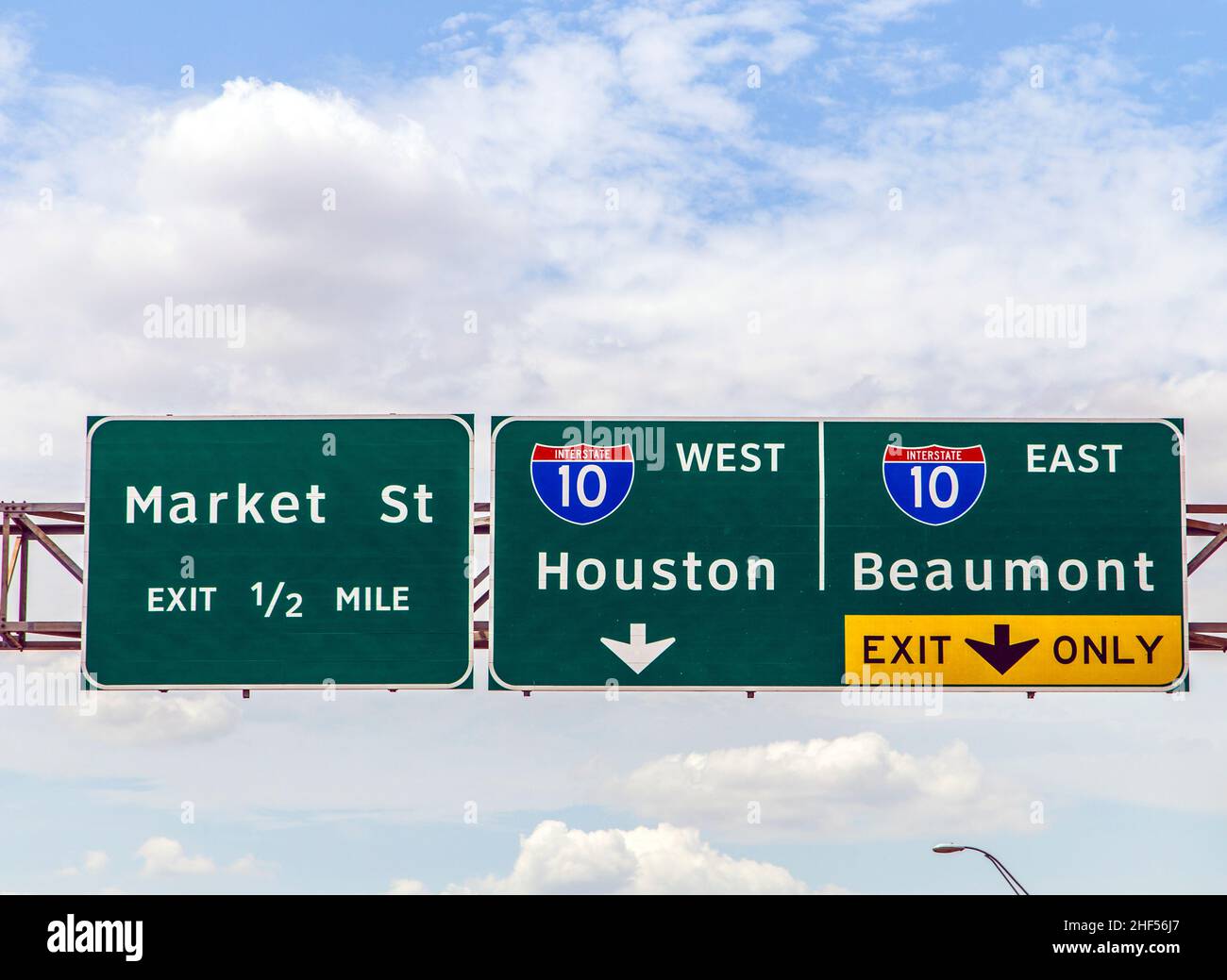 street signs at the interstate in Texas under blue sky Stock Photo - Alamy