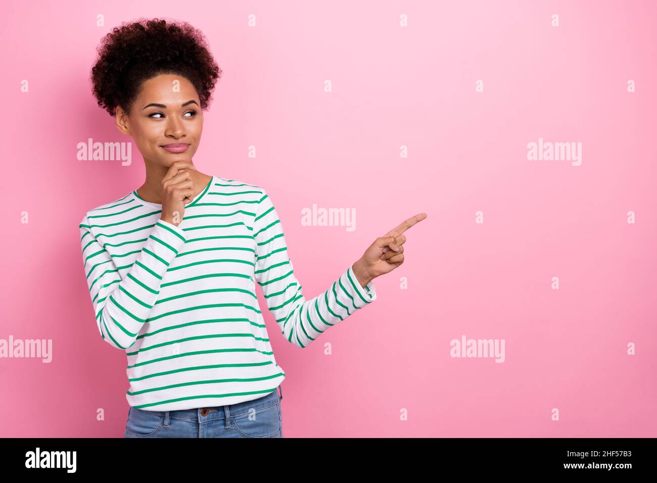 Portrait of attractive minded cheerful girl showing copy empty blank space ad solution isolated ...