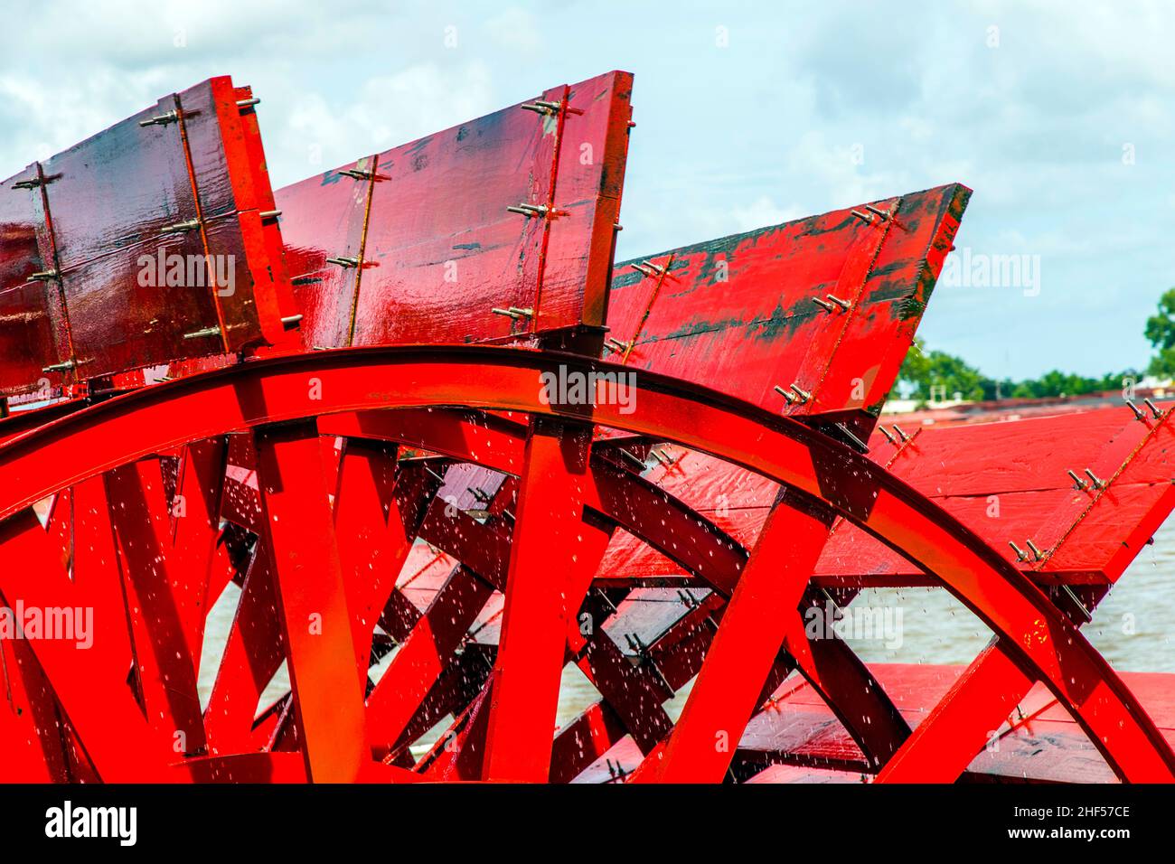 Red Riverboat Paddle Wheel in a River with Trees Stock Photo - Alamy
