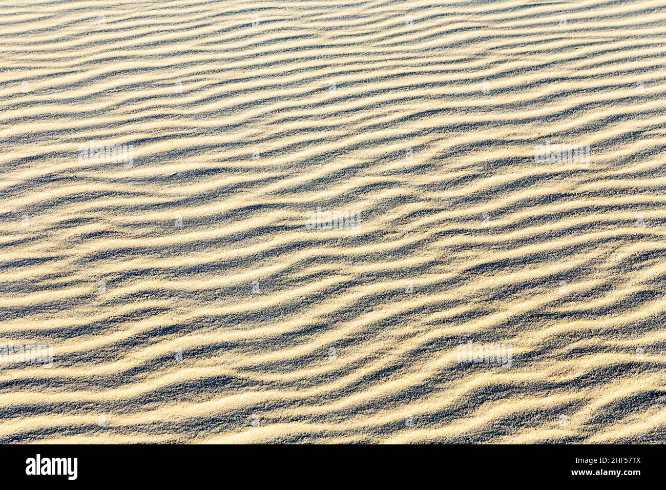 Abstract background of sand ripples at the beach Stock Photo - Alamy