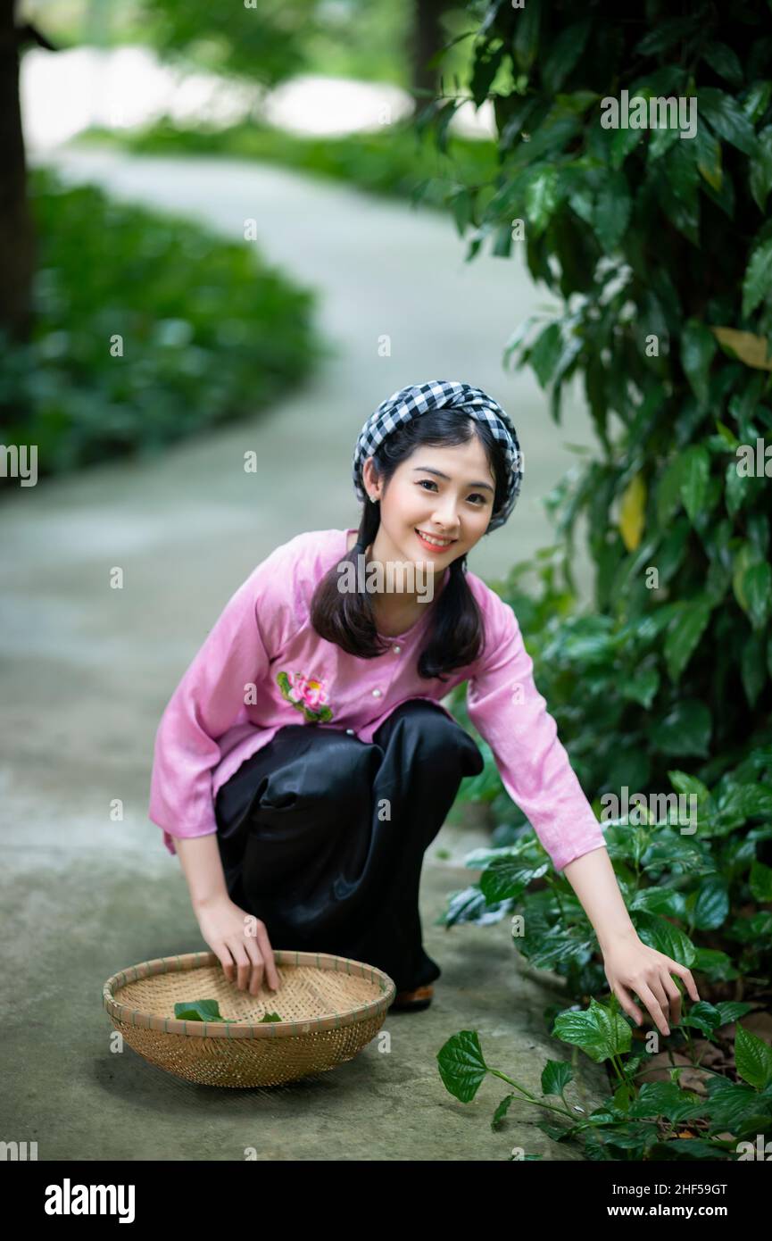 Ho Chi Minh city, Viet Nam: Traditional costume of a Vietnamese girl in ...