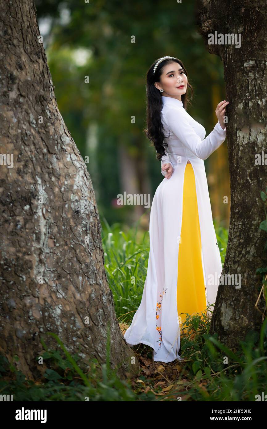 Ho Chi Minh City, Vietnam: Portrait women in white ao dai Vietnam, The Ao dai ( long-dress ...