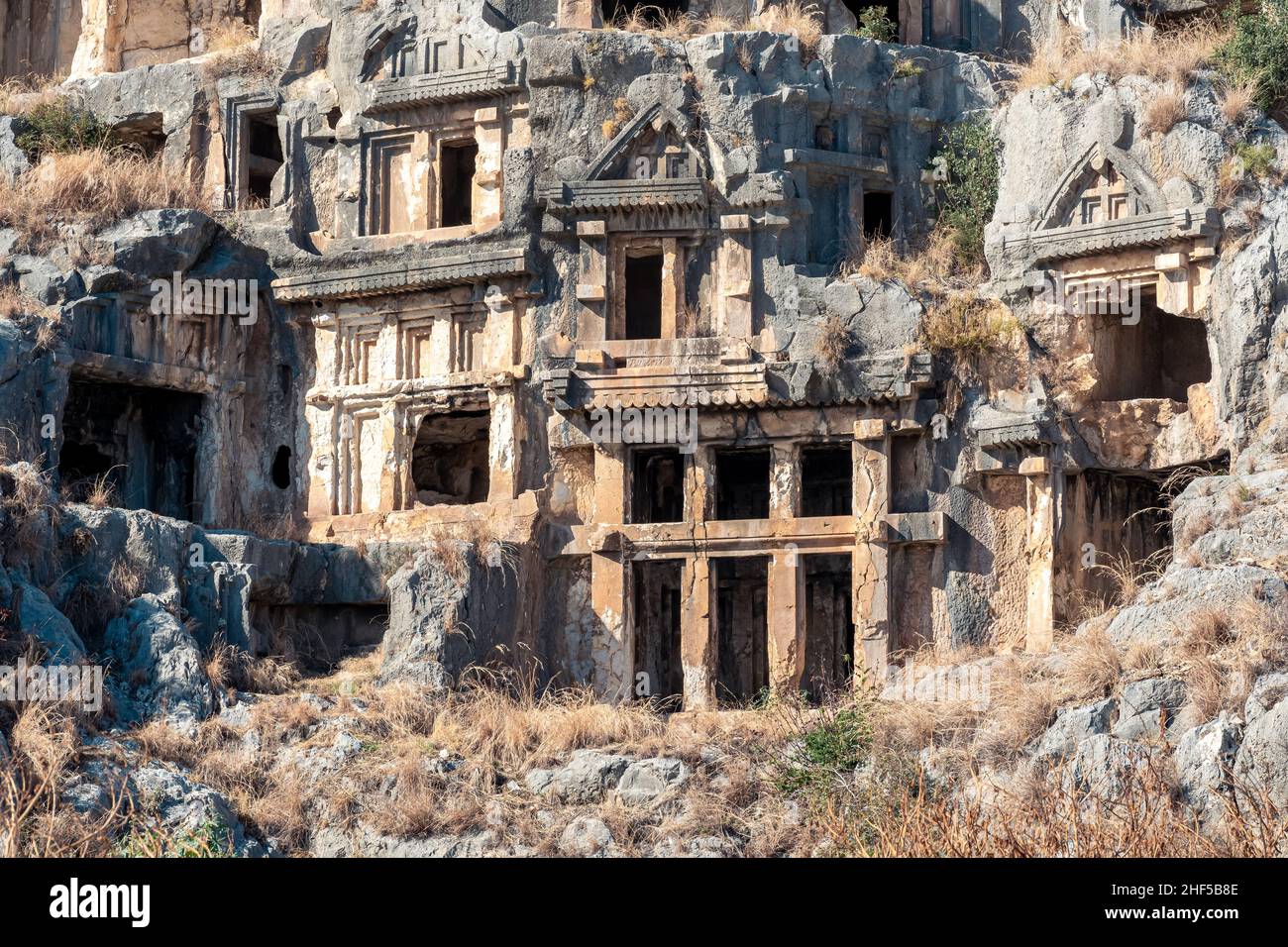 ruins of a rocky necropolis with stone-cut tombs in Myra Lycian Stock ...