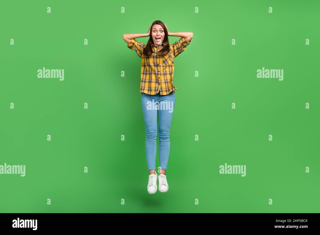 Full Body Portrait Of Astonished Impressed Girl Arms On Head Open Mouth