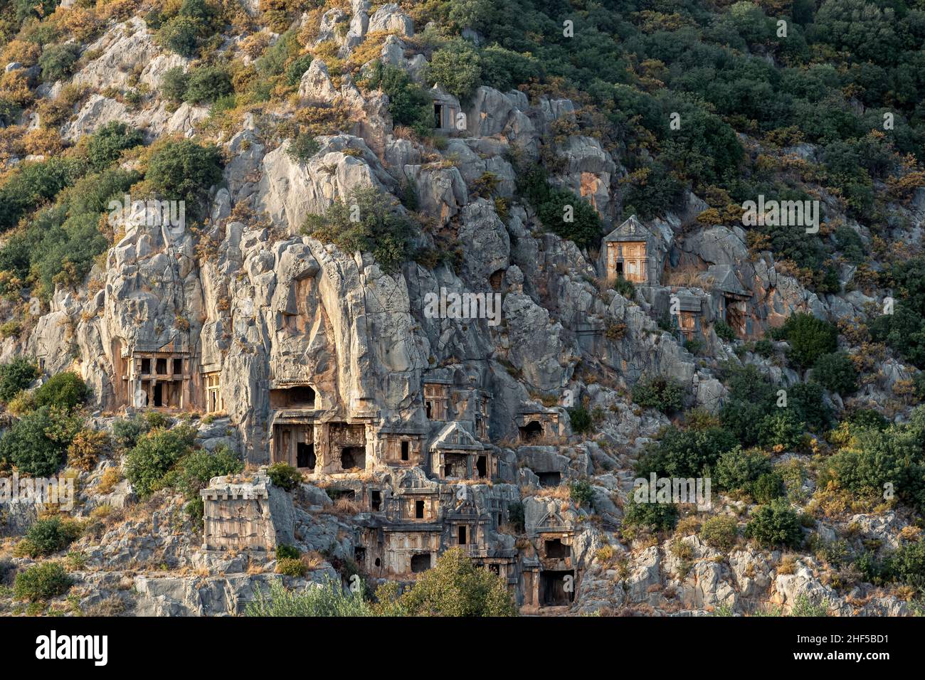ruins of a rocky necropolis with stone-cut tombs in Myra Lycian Stock ...