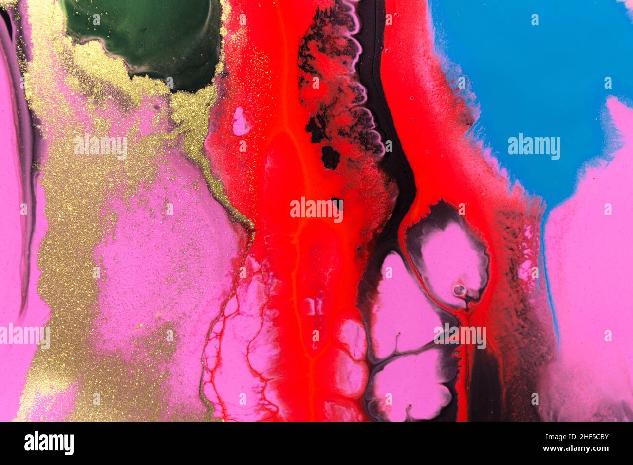 Abstract fluorescent ink mix with gold dust Stock Photo - Alamy