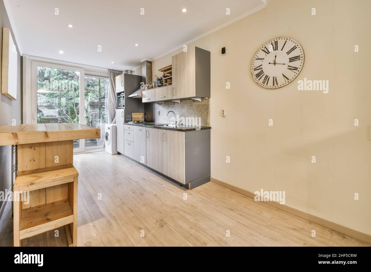 Nice small kitchen area with gray kitchen unit and parquet floor Stock ...