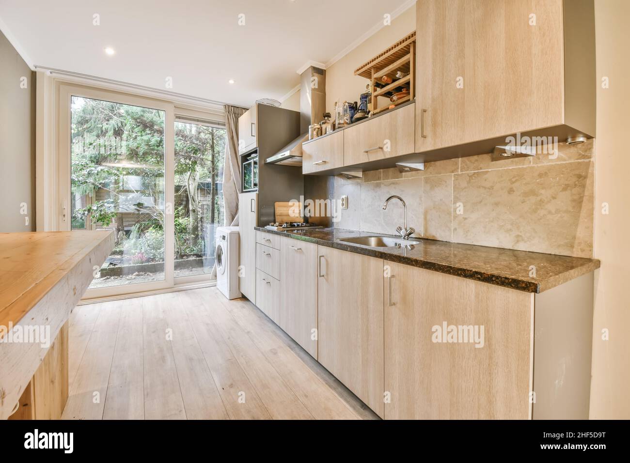 Nice small kitchen area with gray kitchen unit and parquet floor Stock ...