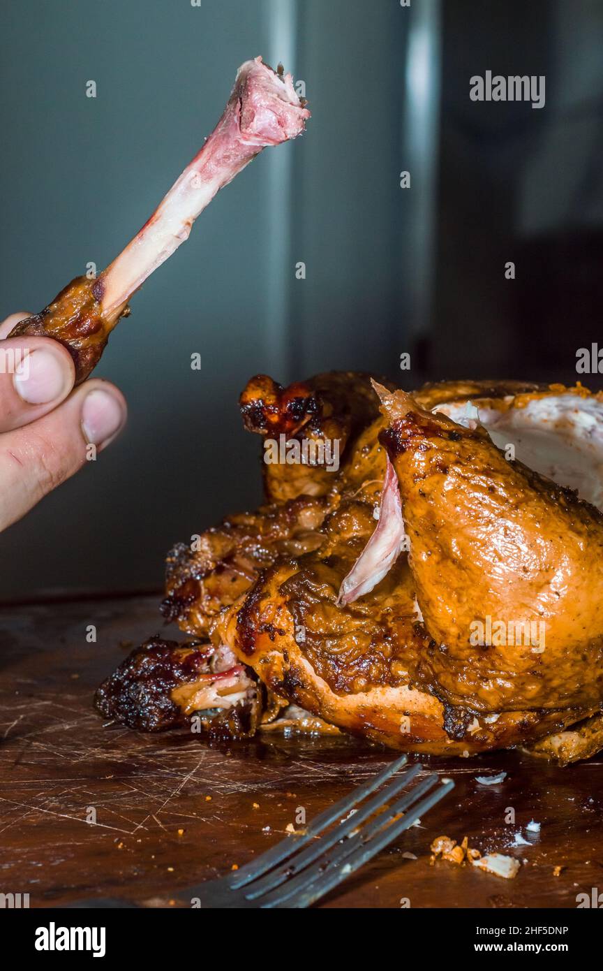 roast chicken with golden skin, copy space and knife cutting the ...