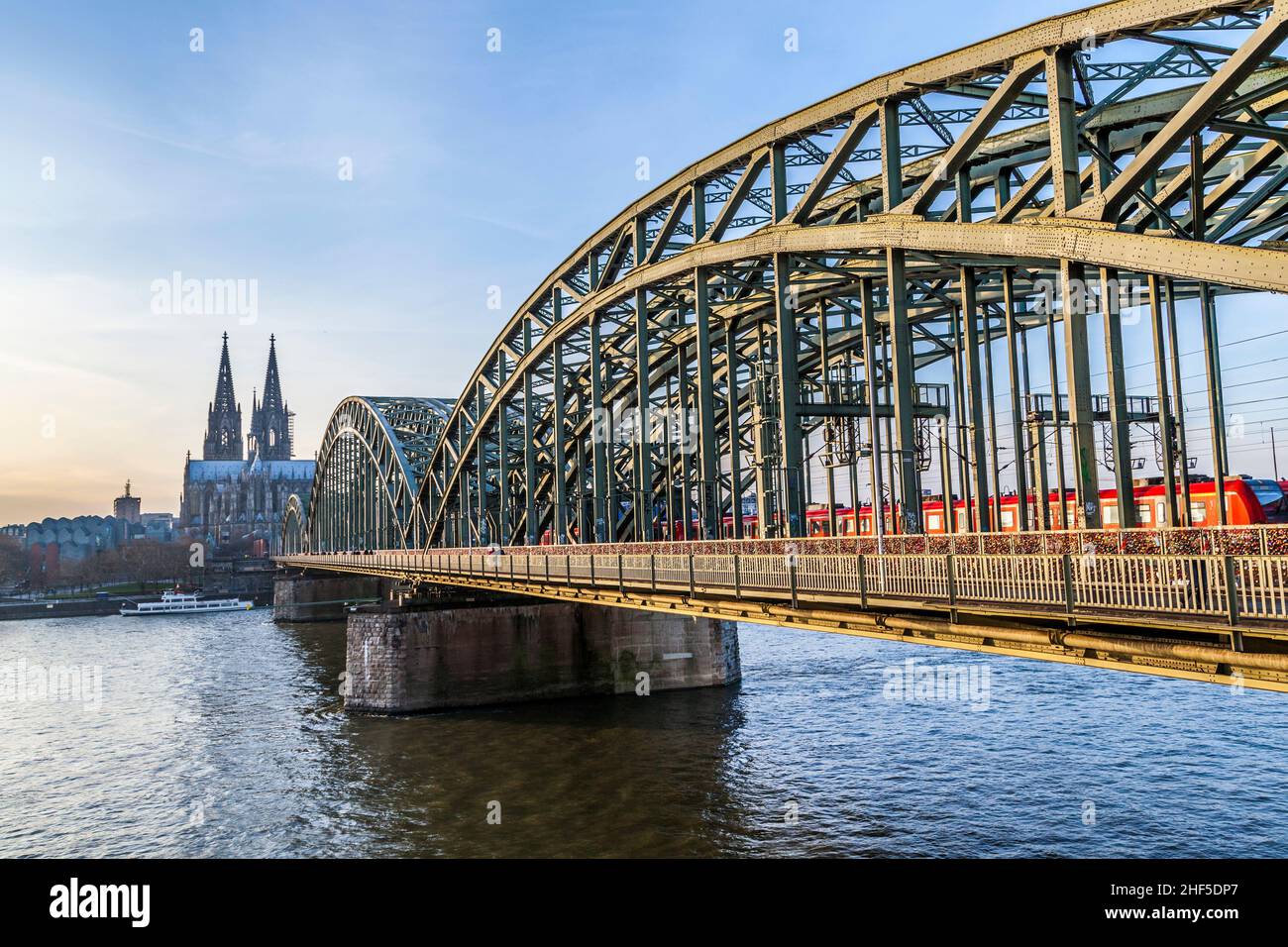 Cathedral and railway bridge crossing river Rhine with skyline in ...