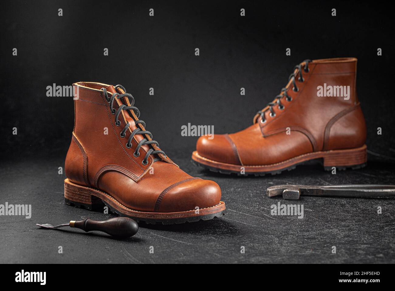Handcrafted brown leather shoes with cobbler tools Stock Photo - Alamy