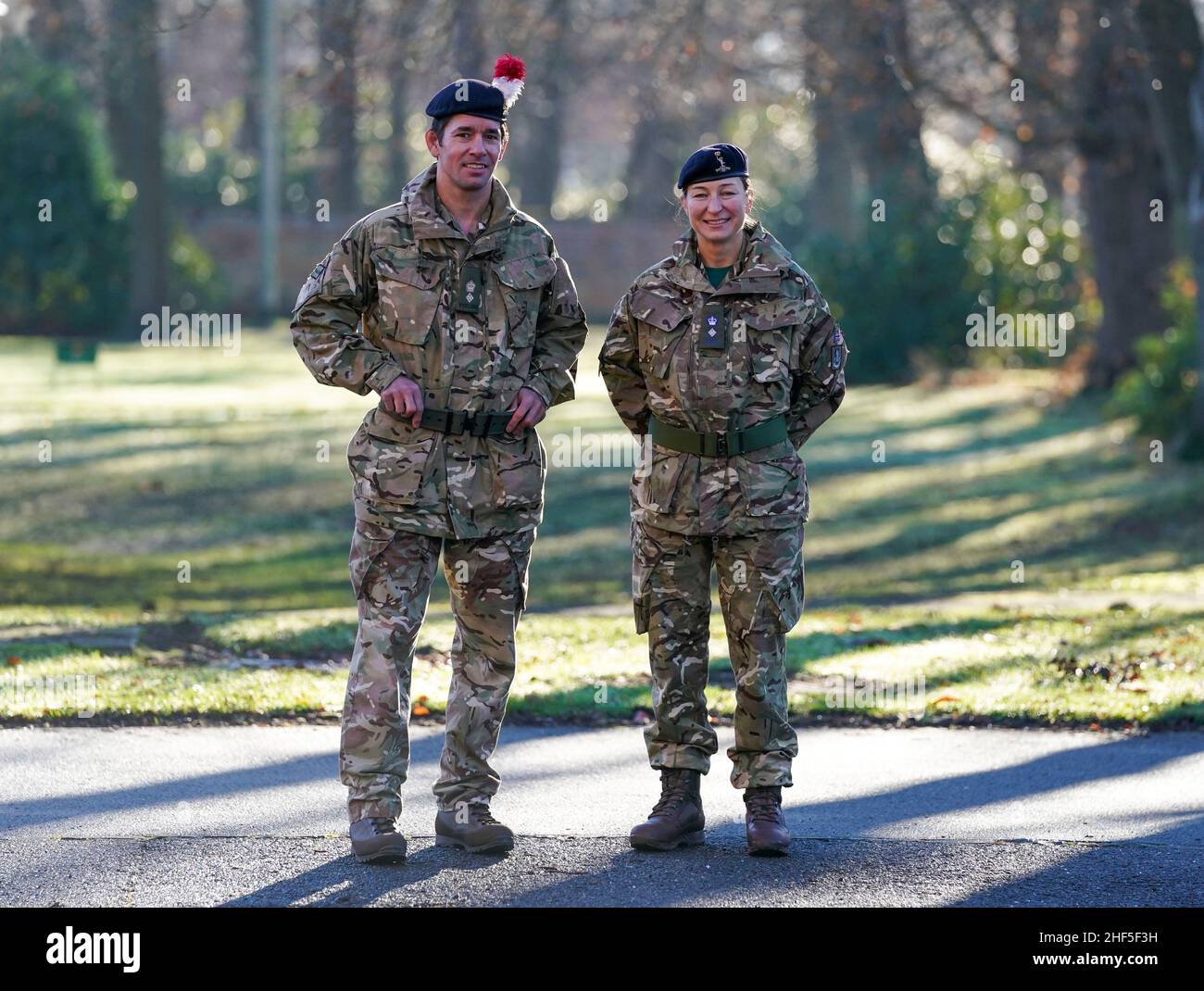 Lt Col Shamus Kelly walks with his wife, Lt Col Lyndsey Kelly, as he ...