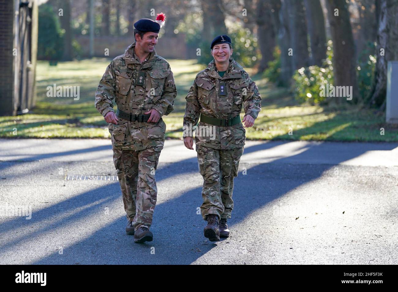 Lt Col Shamus Kelly walks with his wife, Lt Col Lyndsey Kelly, as he ...