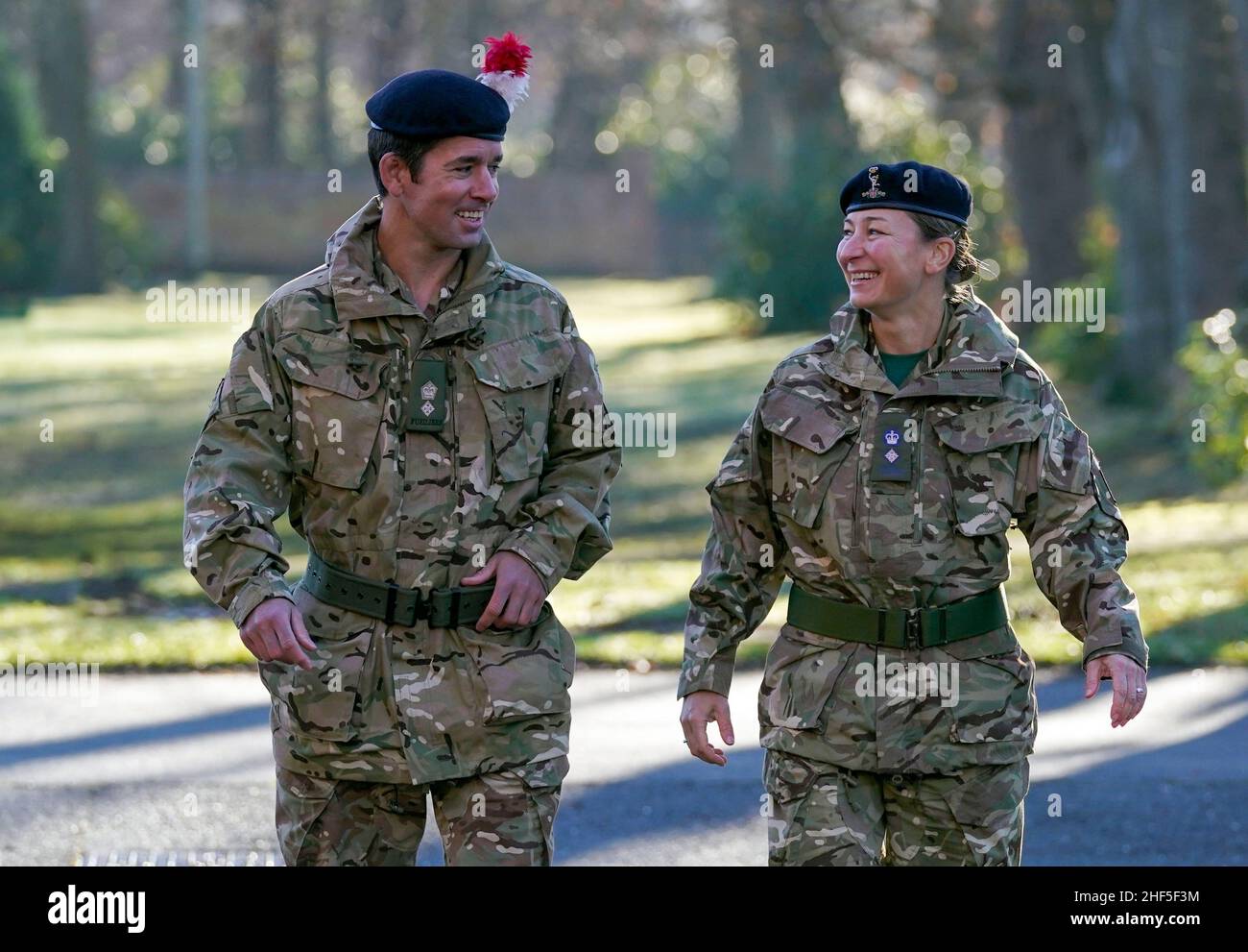 Lt Col Shamus Kelly walks with his wife, Lt Col Lyndsey Kelly, as he ...