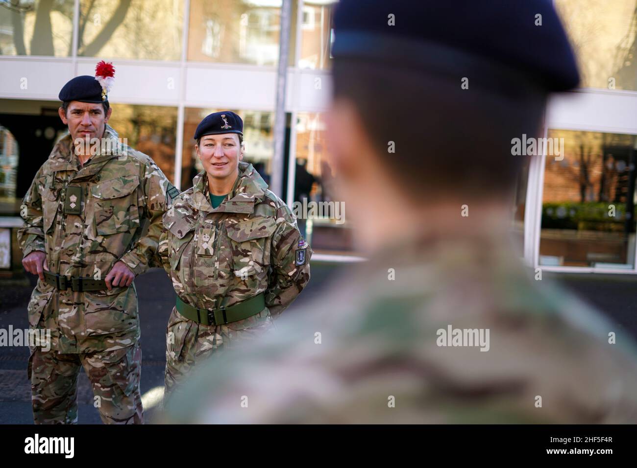 Lt Col Shamus Kelly and his wife, Lt Col Lyndsey Kelly talk to soldiers ...