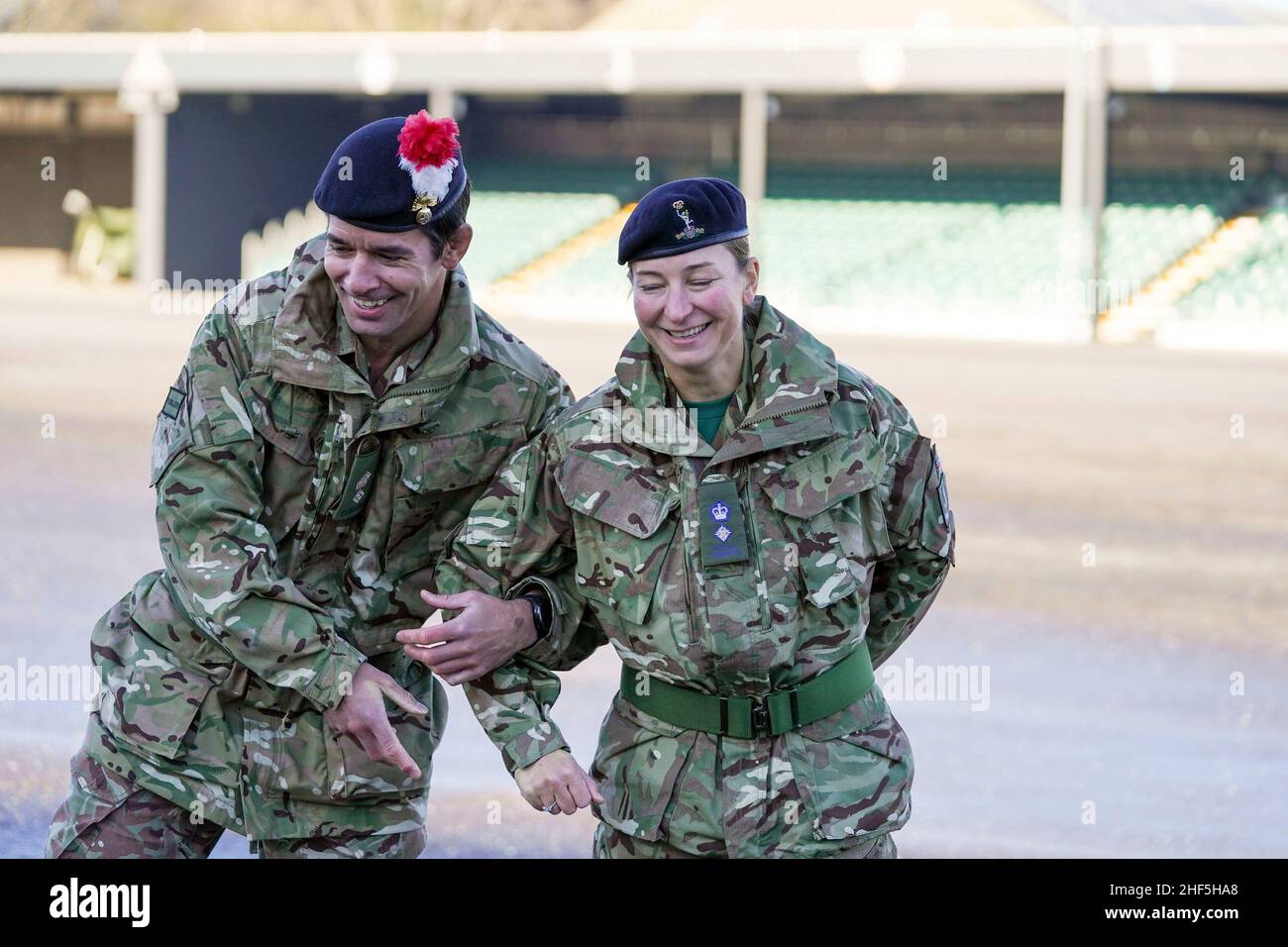 Lt Col Shamus Kelly shakes the hand of his wife, Lt Col Lyndsey Kelly ...