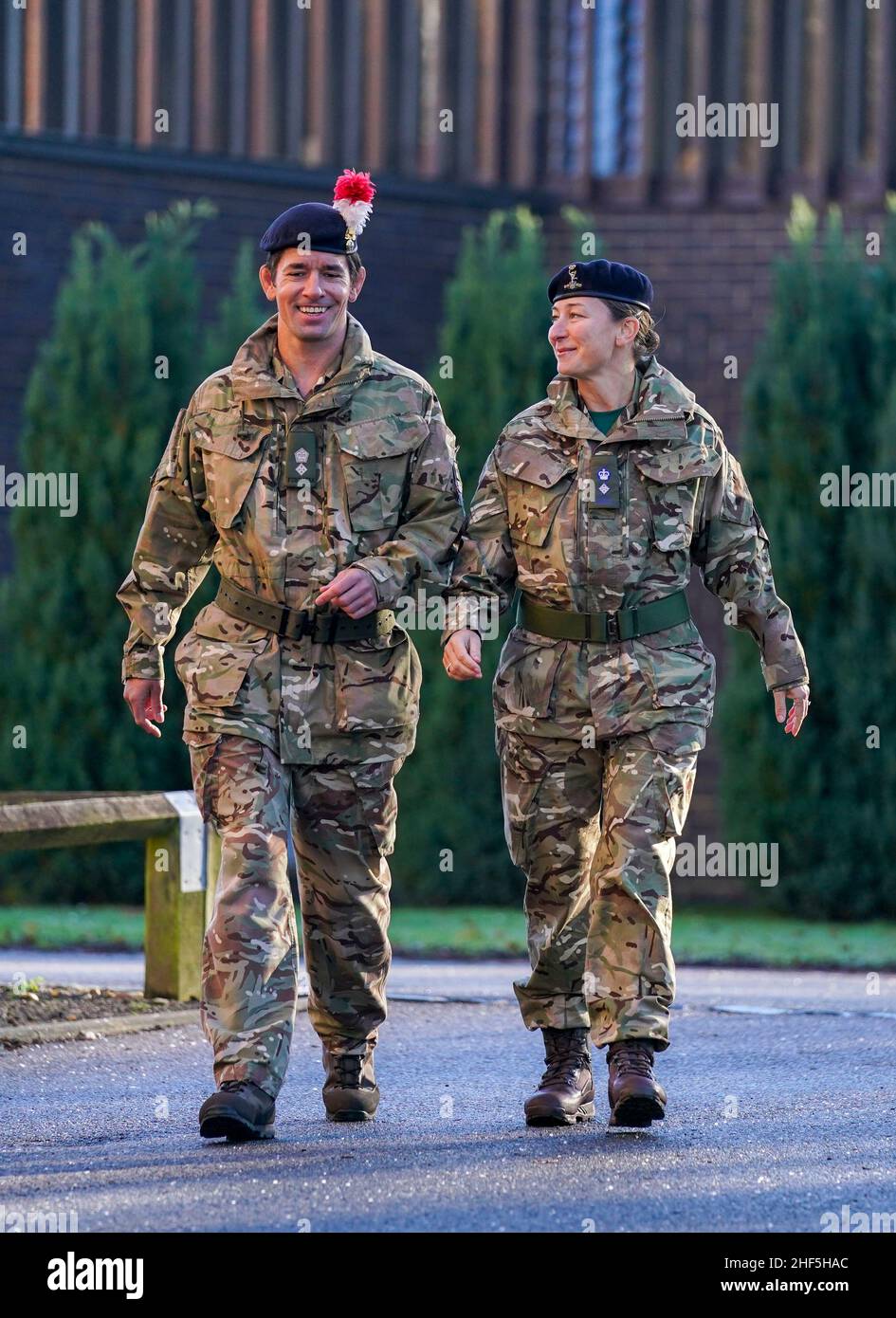 Lt Col Shamus Kelly walks with his wife, Lt Col Lyndsey Kelly, as he ...