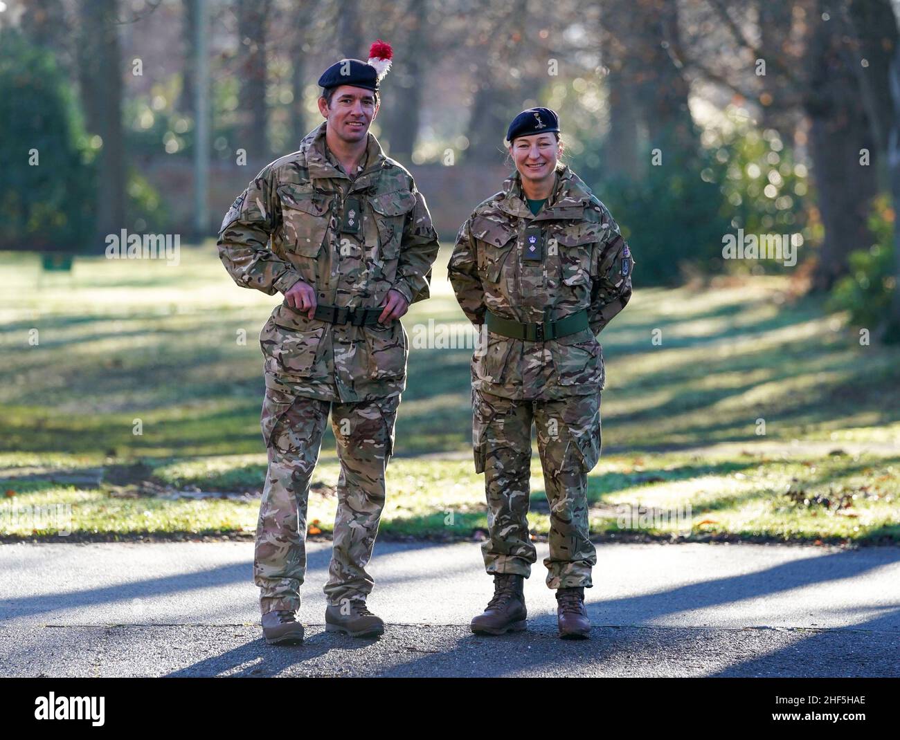 Lt Col Shamus Kelly walks with his wife, Lt Col Lyndsey Kelly, as he ...