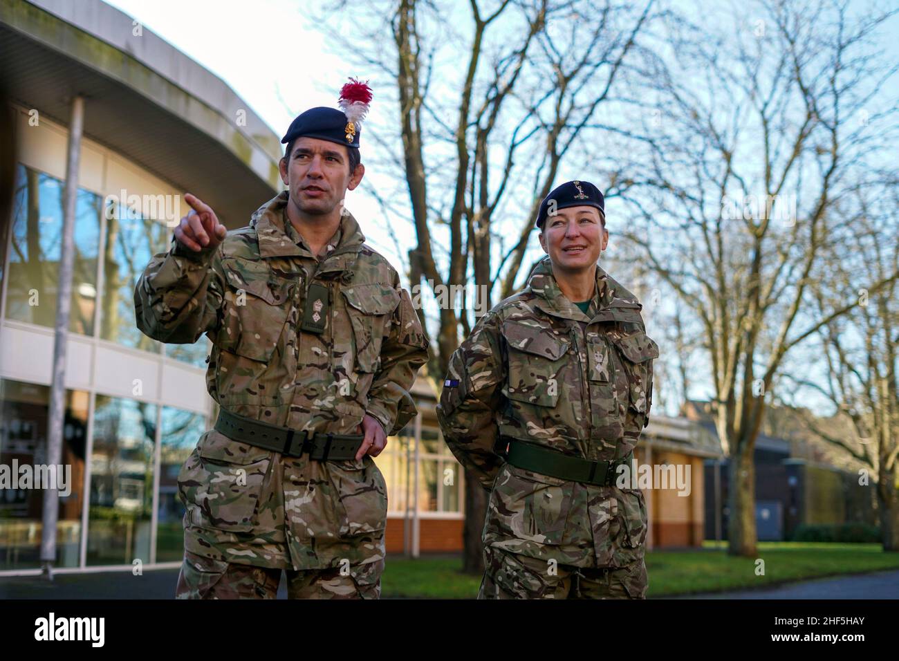 Lt Col Shamus Kelly and his wife, Lt Col Lyndsey Kelly talk to soldiers ...