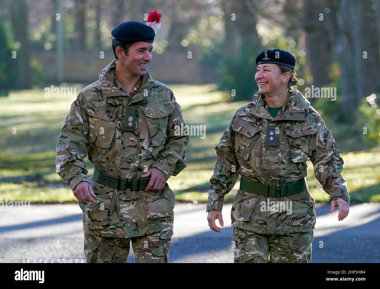 Lt Col Shamus Kelly walks with his wife, Lt Col Lyndsey Kelly, as he ...