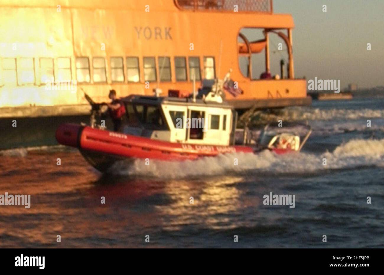 Security boat from Coast Guard Maritime Safety escorts Staten Island ...