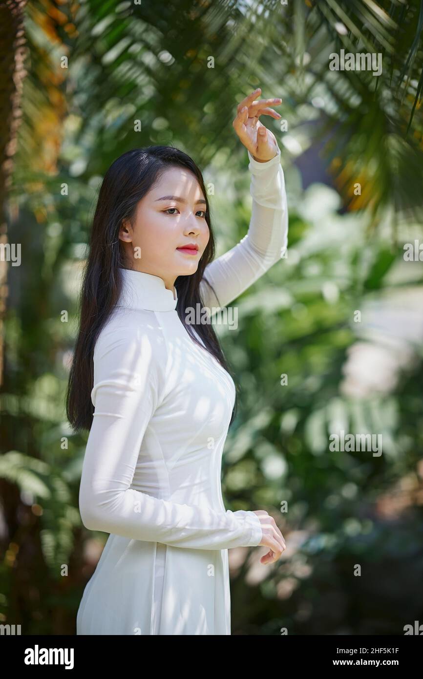 Ho Chi Minh City, Vietnam: Portrait women in white ao dai Vietnam, The Ao dai ( long-dress ...