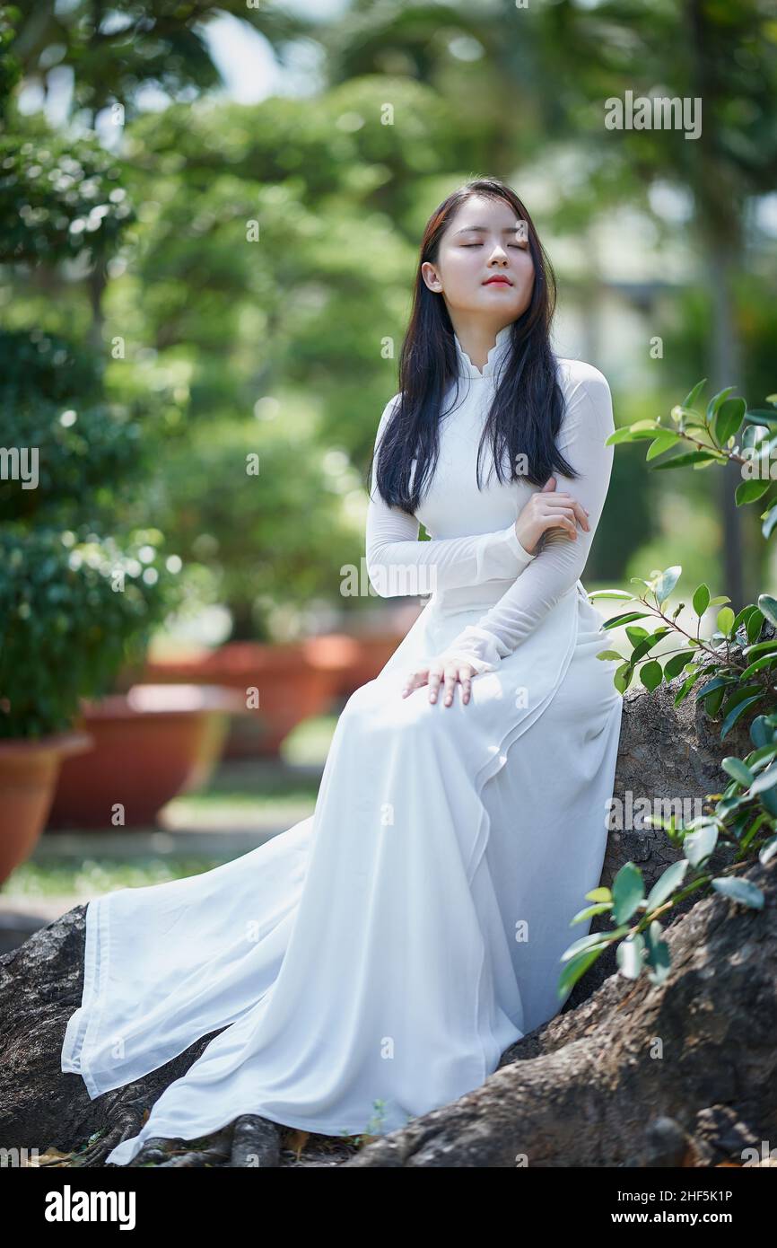 Ho Chi Minh City, Vietnam: Portrait women in white ao dai Vietnam, The Ao dai ( long-dress ...