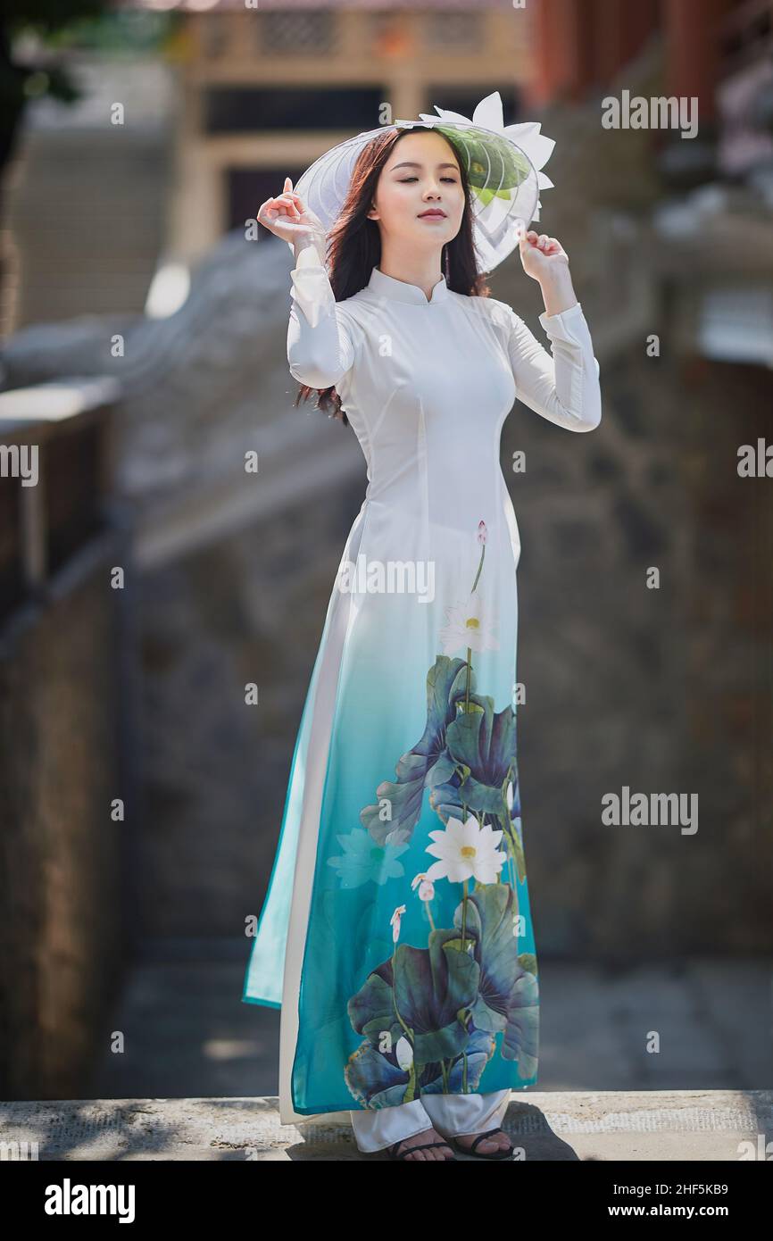 Ho Chi Minh city, Viet Nam: Ao Dai, Beautiful girl in Vietnamese traditional costume Stock Photo ...