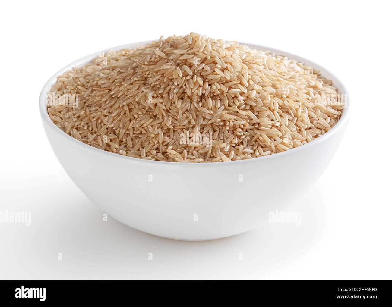 Brown rice in white bowl isolated on white background with clipping ...