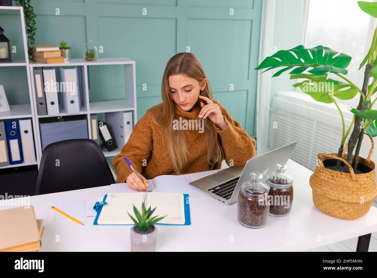 Happy smiling teenage girl student watching learning online video zoom ...