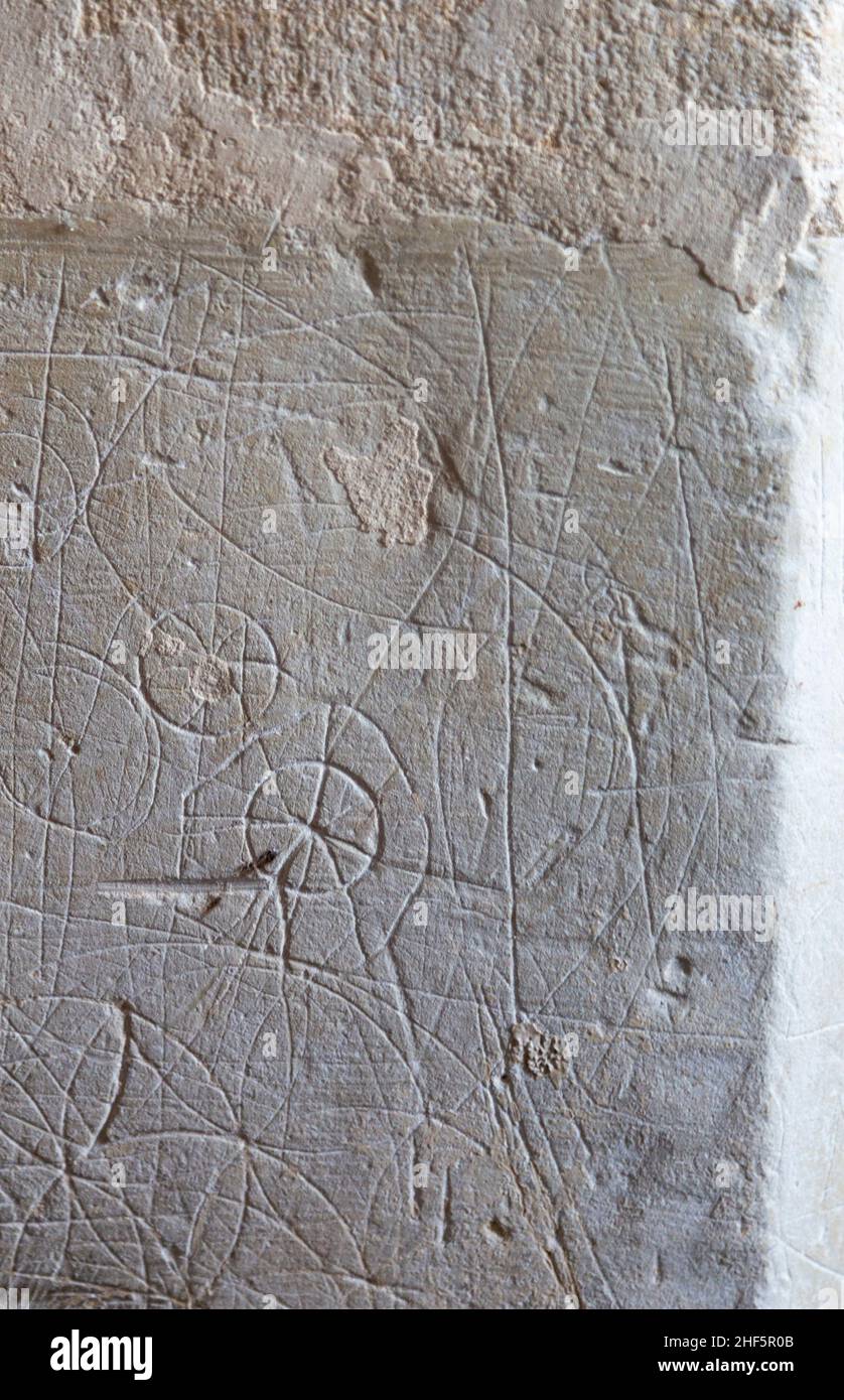 Inscription marks scratched on stone wall geometric circle shapes ...