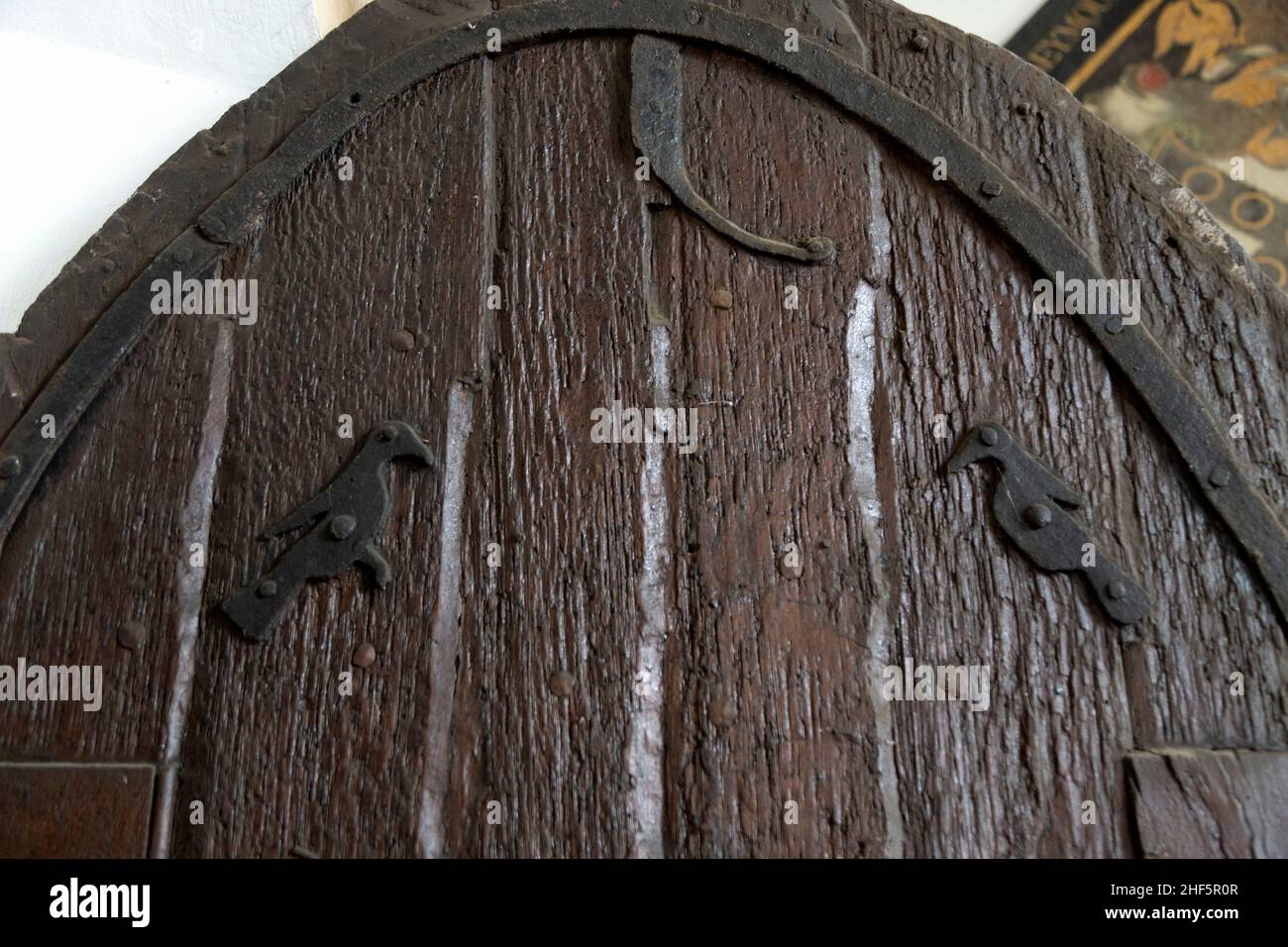 Old metalwork birds on ancient wooden door inside Yaxley church ...