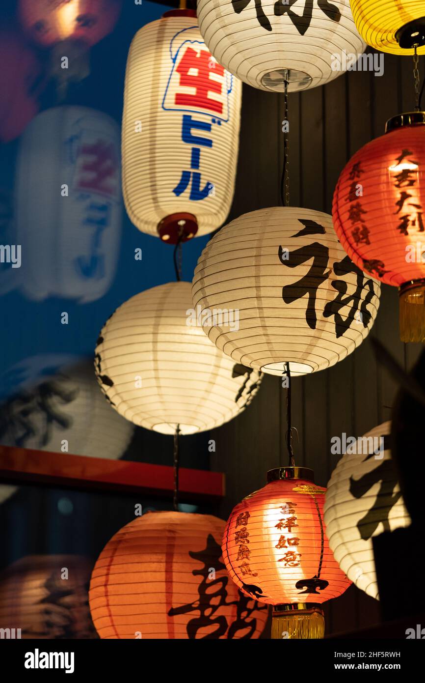Many colorful traditional Illuminated paper lanterns hanging from ...