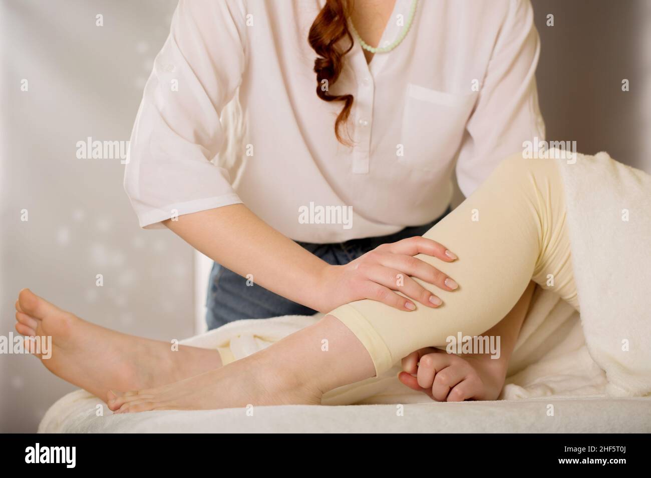 Energy cleansing feet in a stream of reiki. Foot massage Stock Photo ...