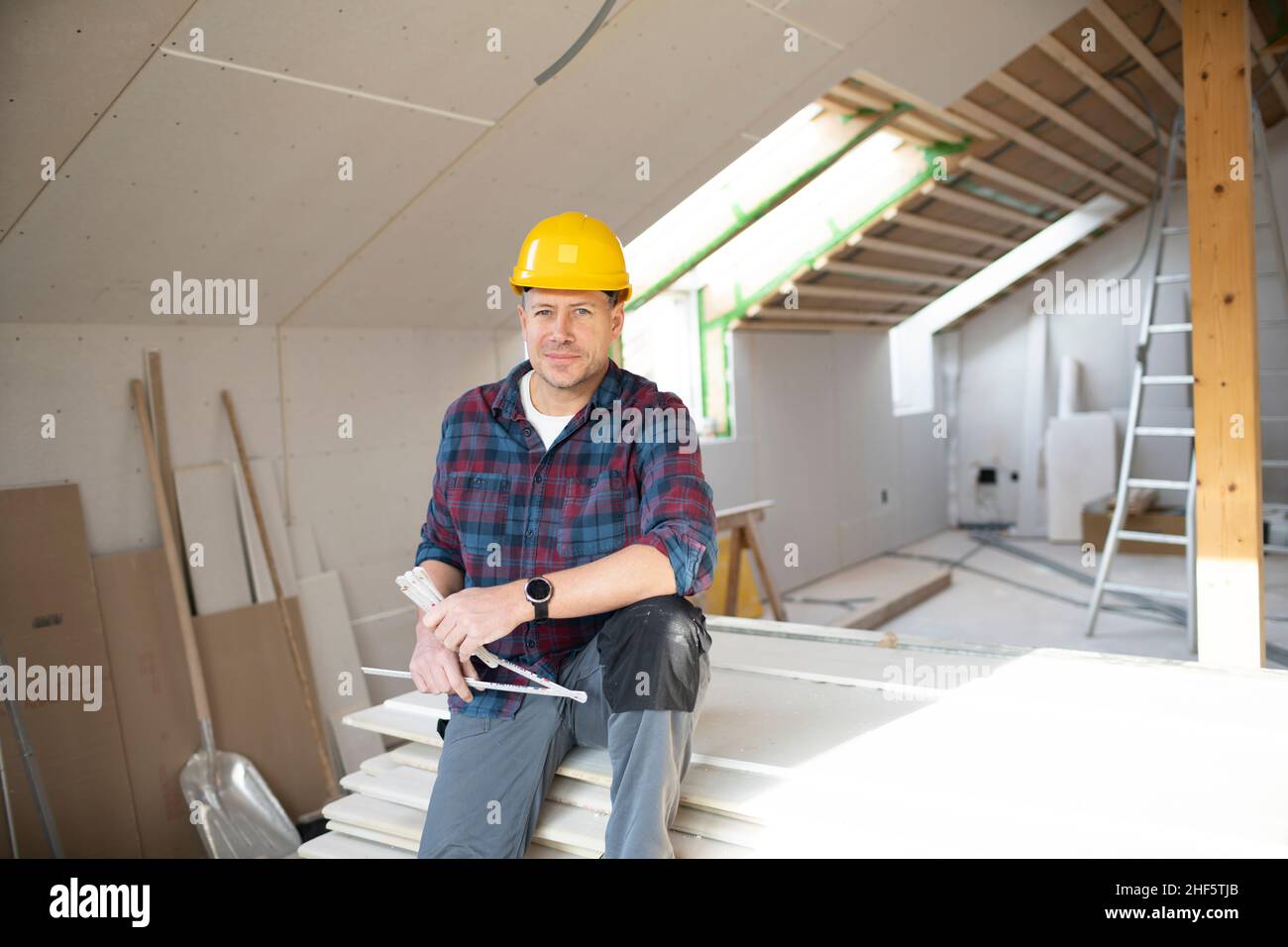 Builder works on constructing hi-res stock photography and images - Alamy