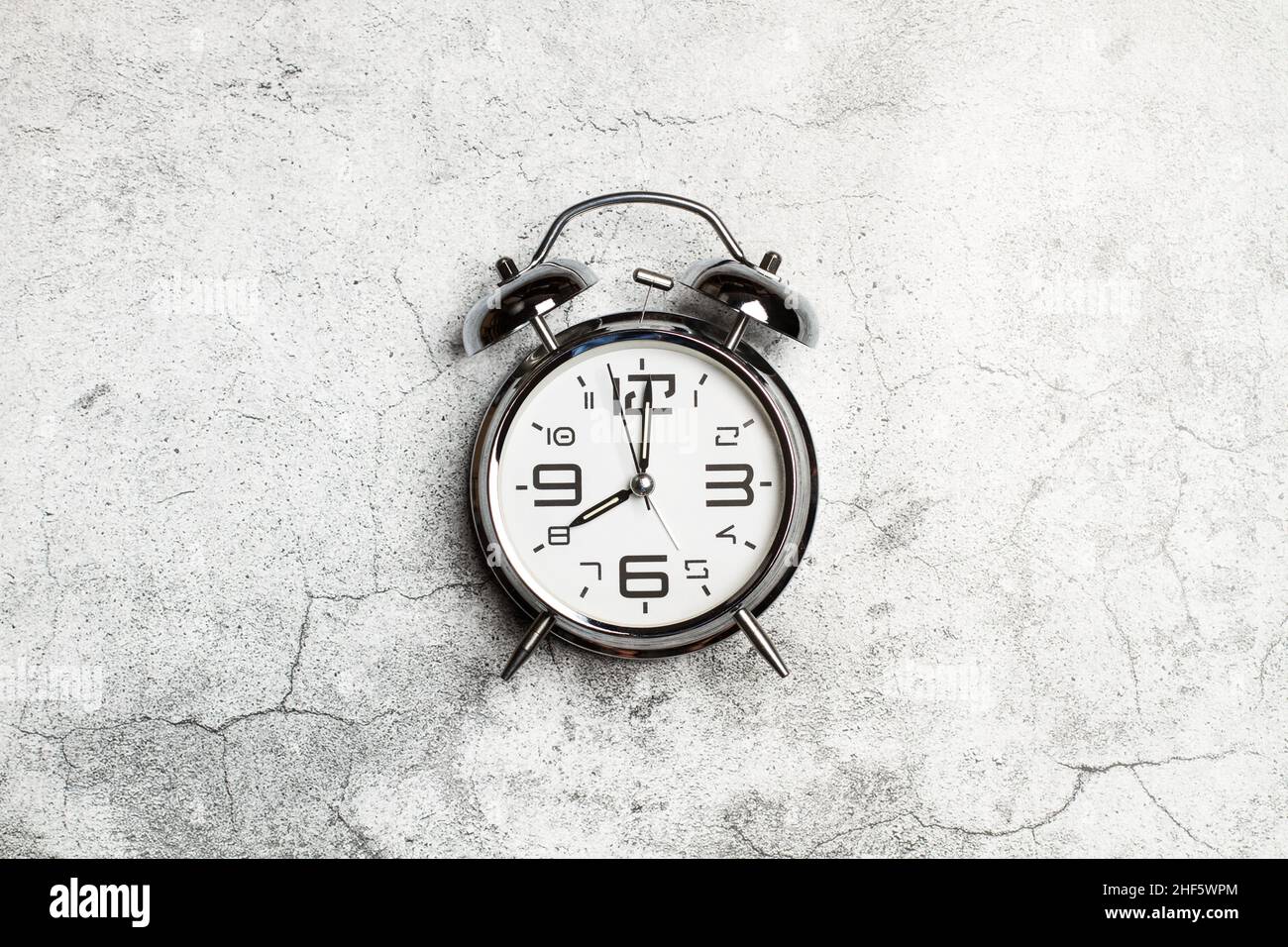 Bell alarm clock on a marble stone background with copy space Stock ...