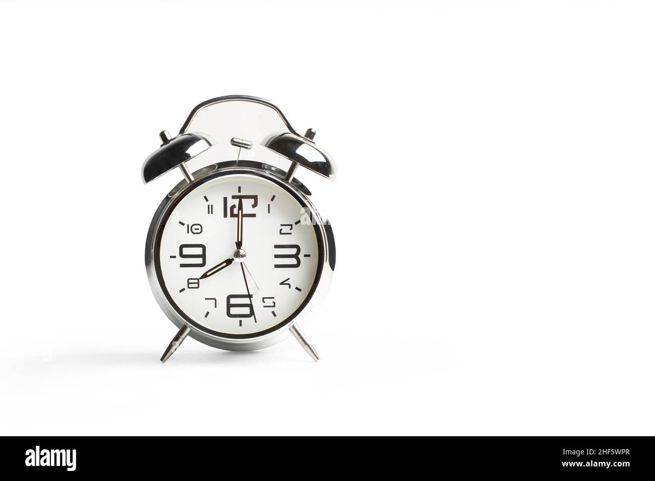 Bell alarm clock on a white background with copy space Stock Photo - Alamy