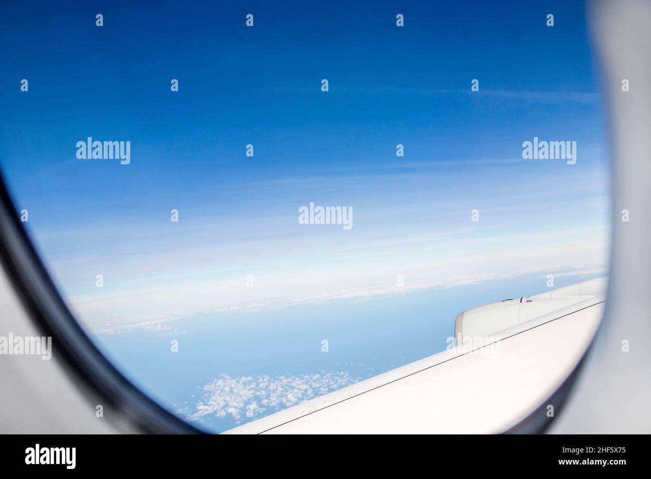 aerial out of an aircraft window with clouds and landscape Stock Photo ...