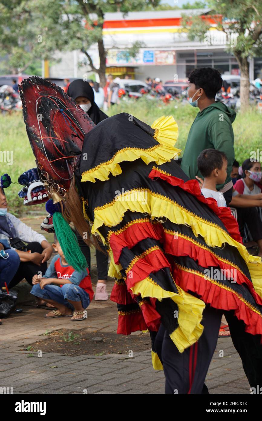 The artist performing Jaranan music dancers and playing a traditional ...