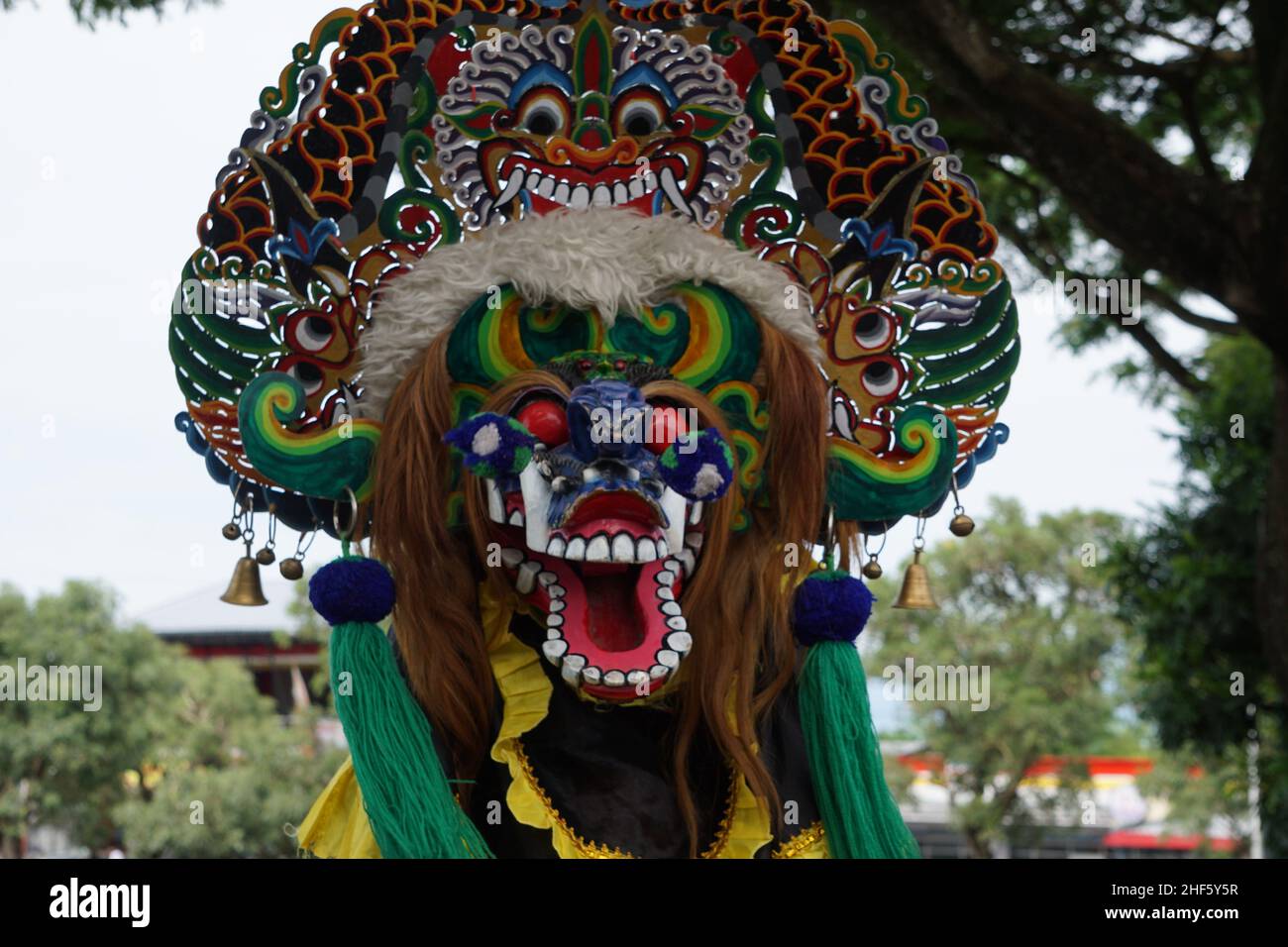 The artist performing Jaranan music dancers and playing a traditional ...