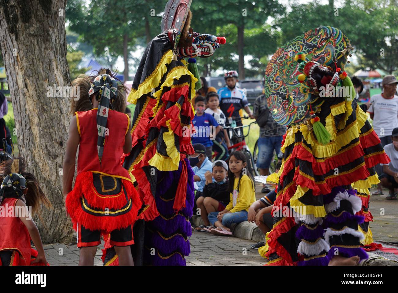 The artist performing Jaranan music dancers and playing a traditional ...
